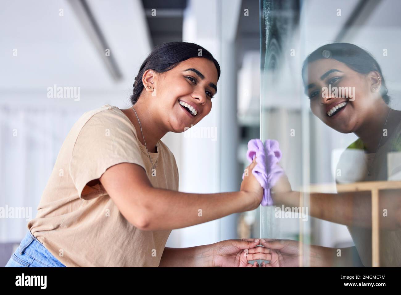 Happy, girl and reflection cleaning window with household cloth and ...