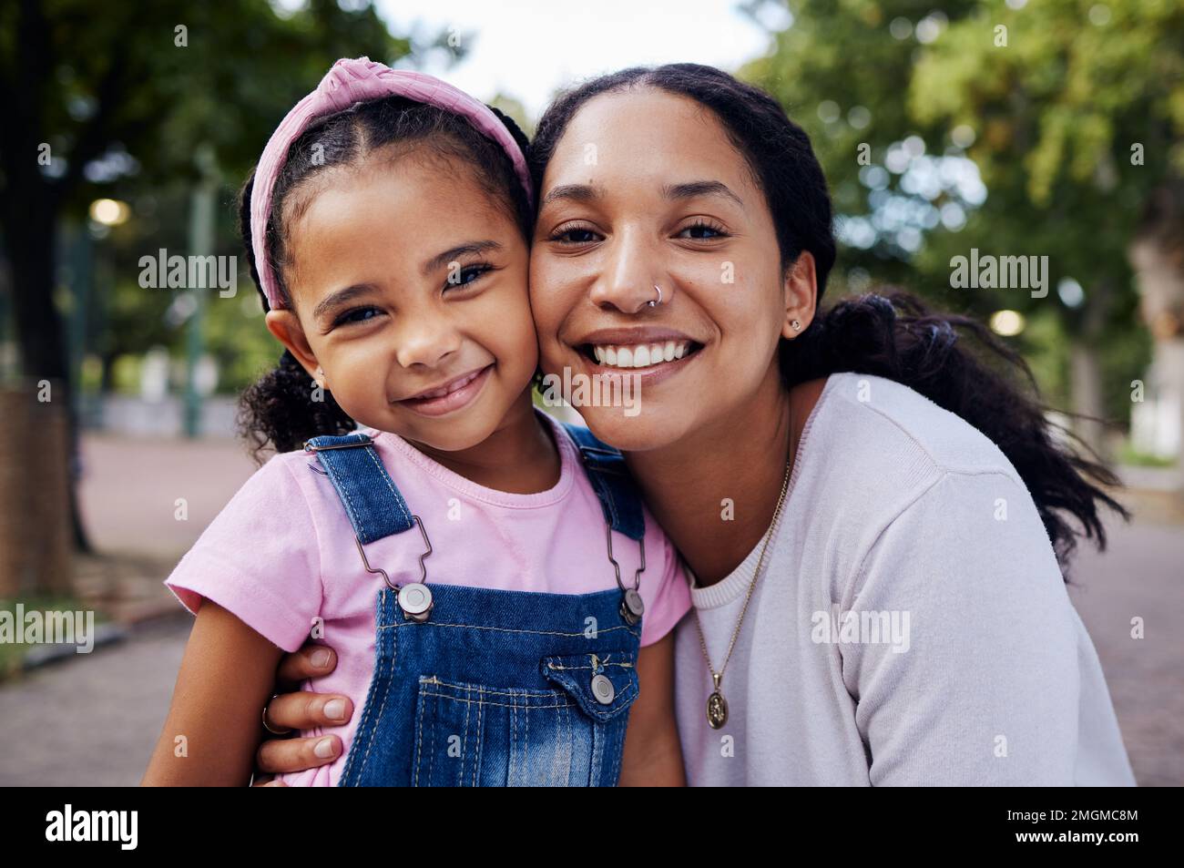 Family, face and mom with kid in park, portrait with hug and fun day ...