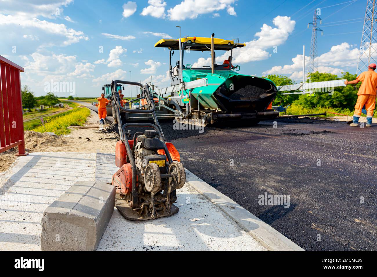 Vibrating plate machine for compacting tarmac parked on the unfinished ...
