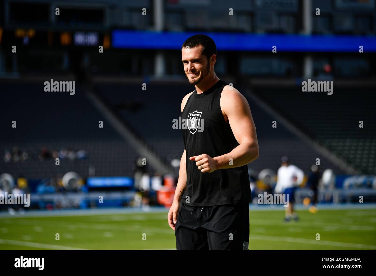 Oakland Raiders quarterback Derek Carr warms up before an NFL football ...