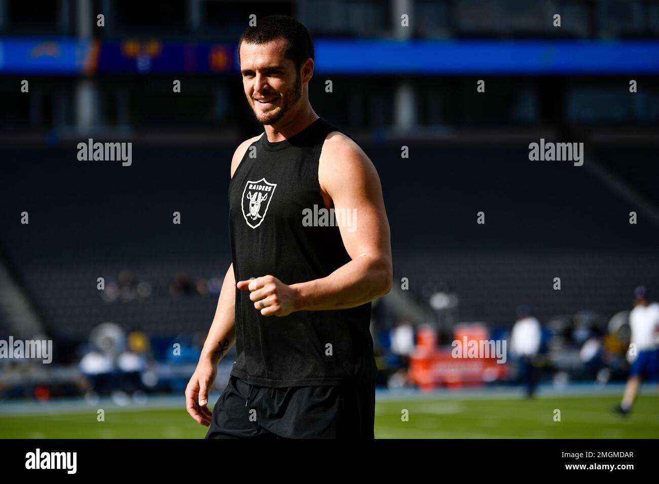 Oakland Raiders quarterback Derek Carr warms up before an NFL football ...