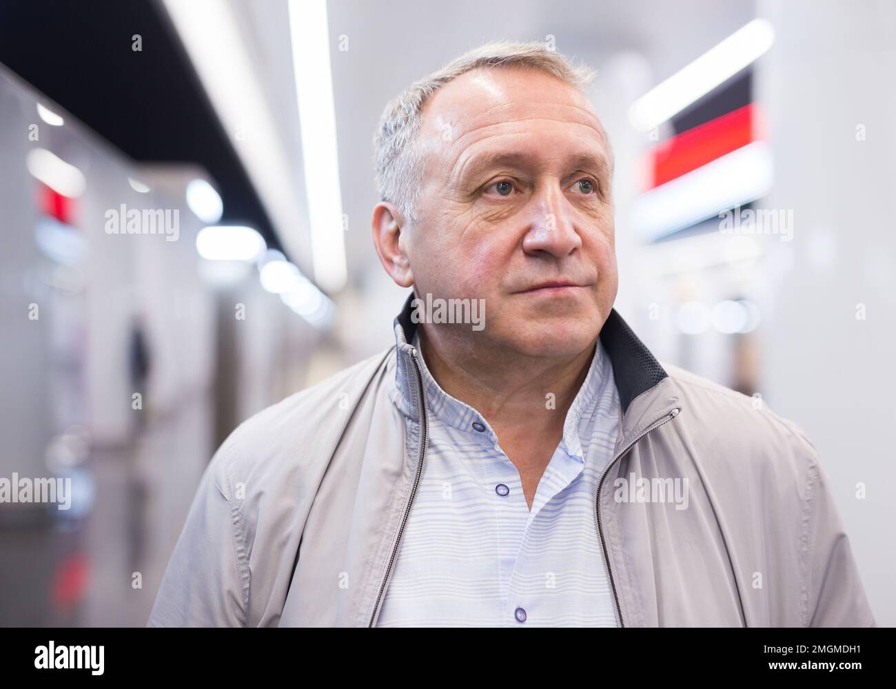 Elderly man waiting for subway train at underground station Stock Photo ...