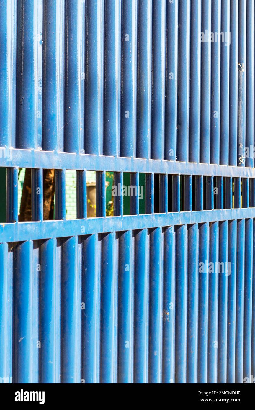 Blue metal gate with space for advertisement Stock Photo - Alamy
