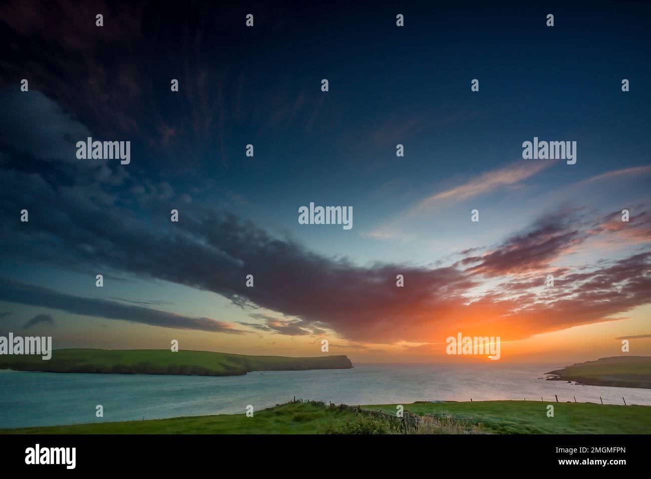 Sunset over Bigton Wick Bay, Shetland, Scotland Stock Photo - Alamy