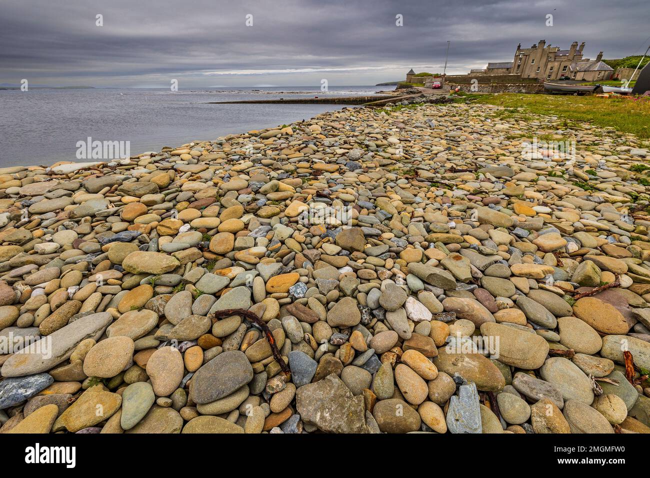 Pebble beach near the jetty at the historic site of Sandsayre pier ...