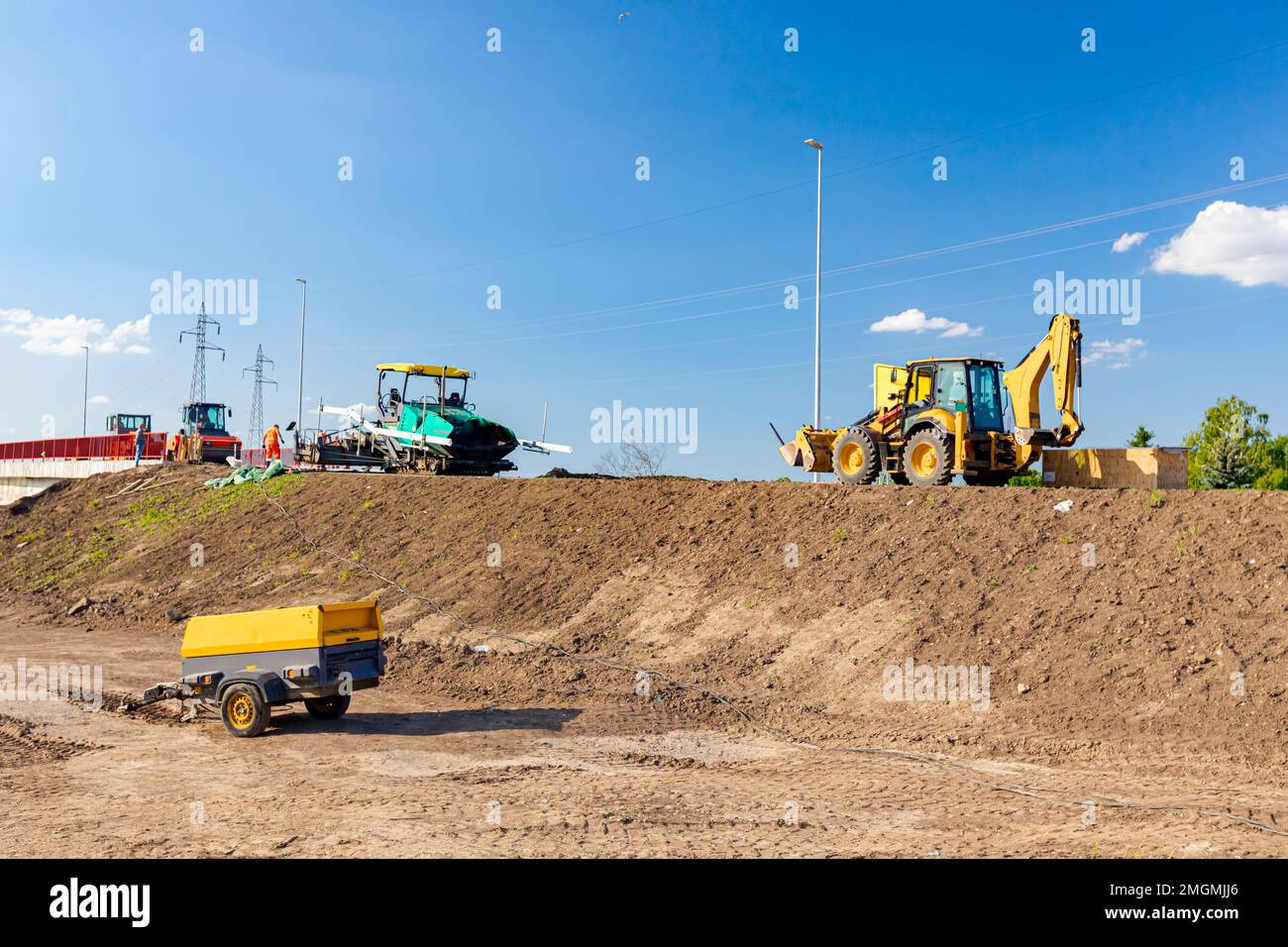Spreader machine lays, pours hot asphalt, laying asphalt. Pneumatic ...