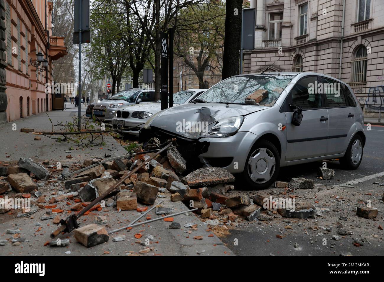 A car is crushed by falling debris after an earthquake in Zagreb ...