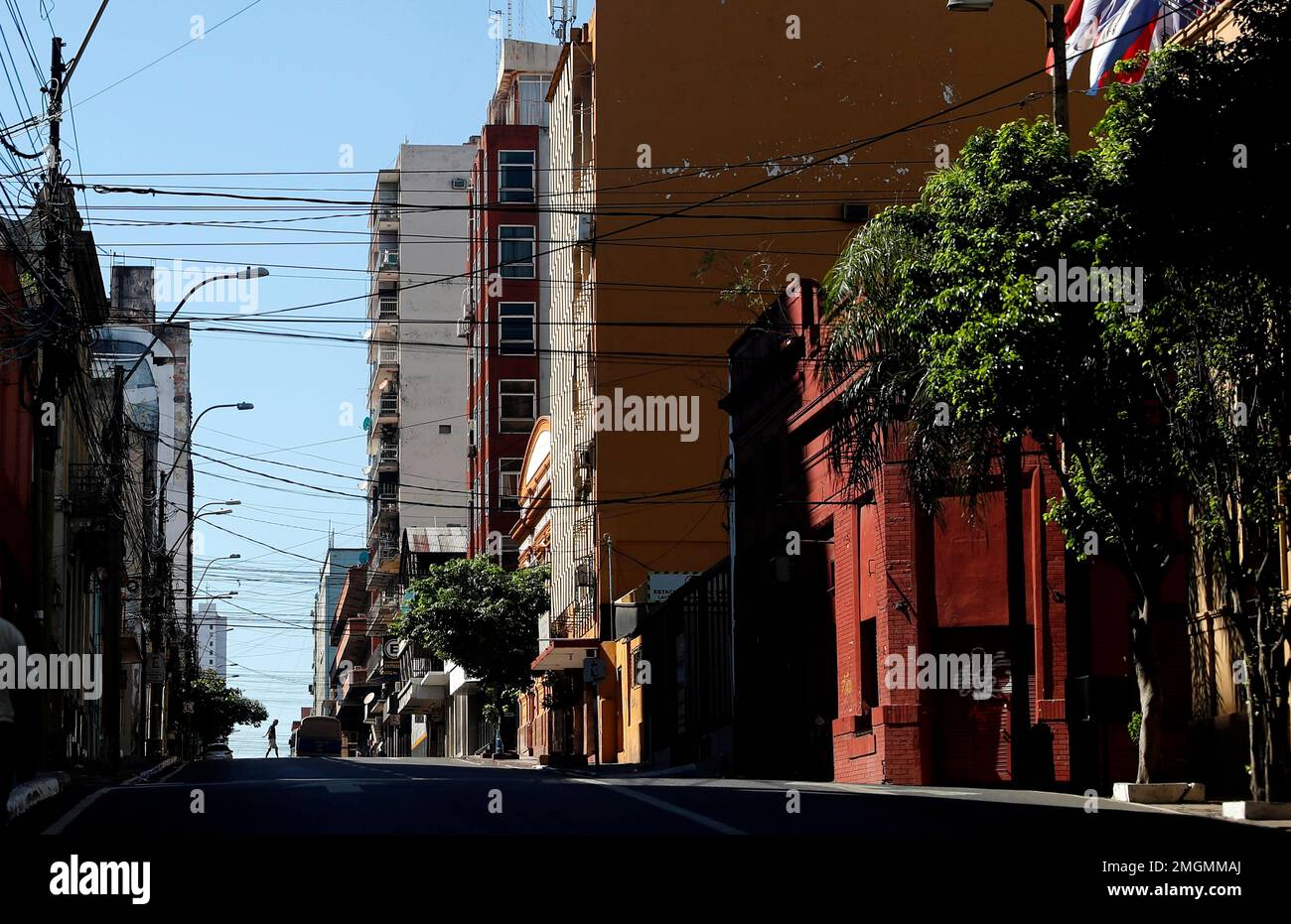 A man crosses Oliva street free of traffic in downtown Asuncion ...
