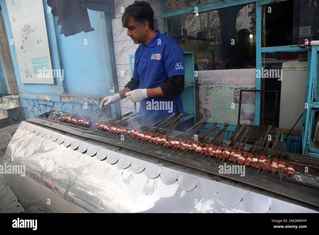 An Afghan man prepares to make a famous Afghan food "Kabab" at a ...