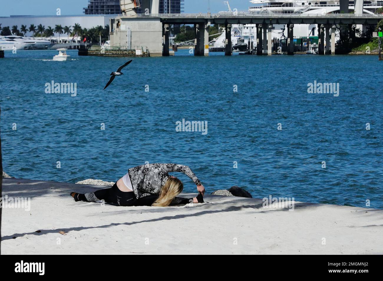 A woman works out near Bayfront Park amid the coronavirus outbreak ...