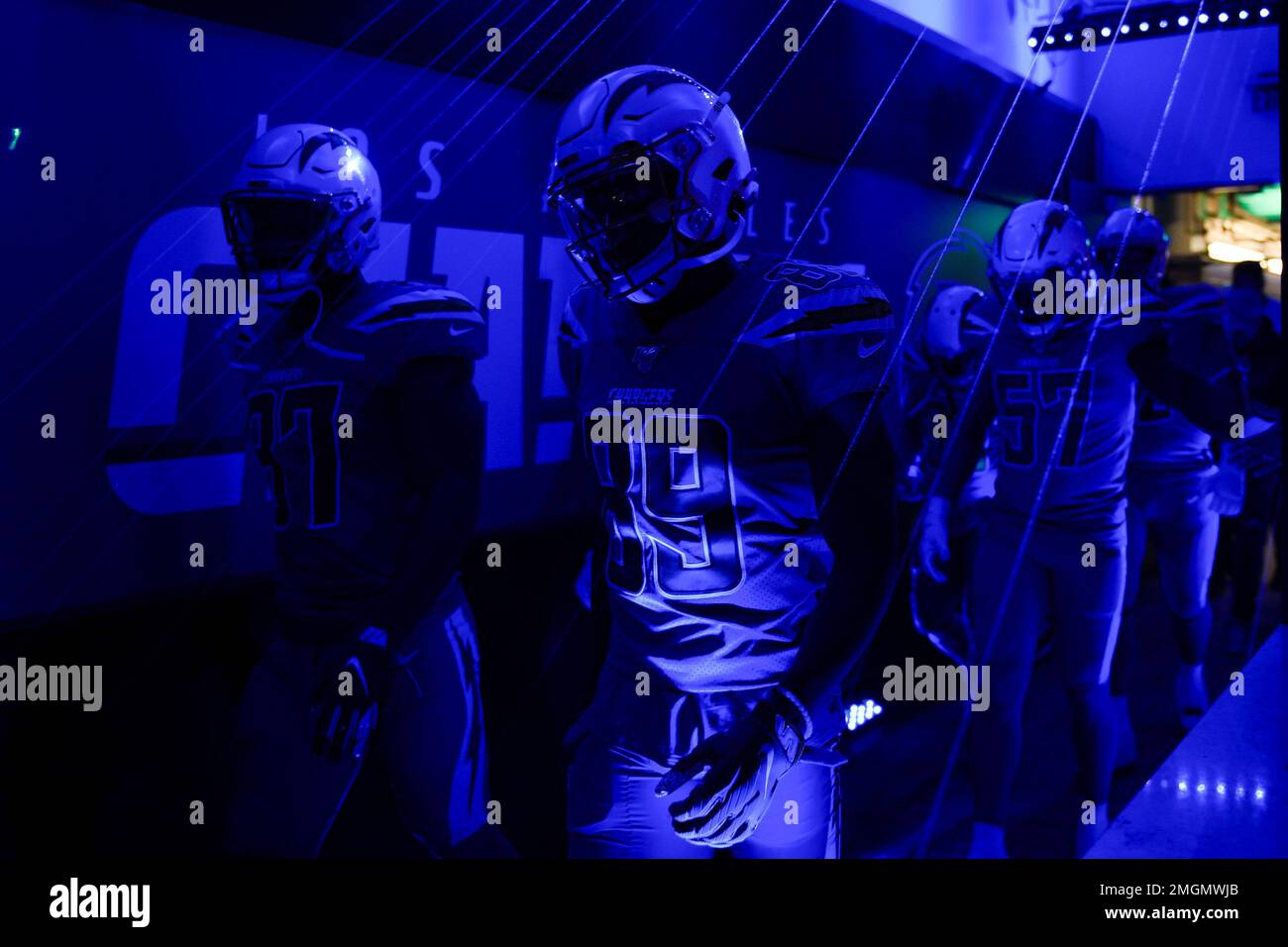 Los Angeles Chargers' Jason Moore, right, and Andrew Vollert heads to ...