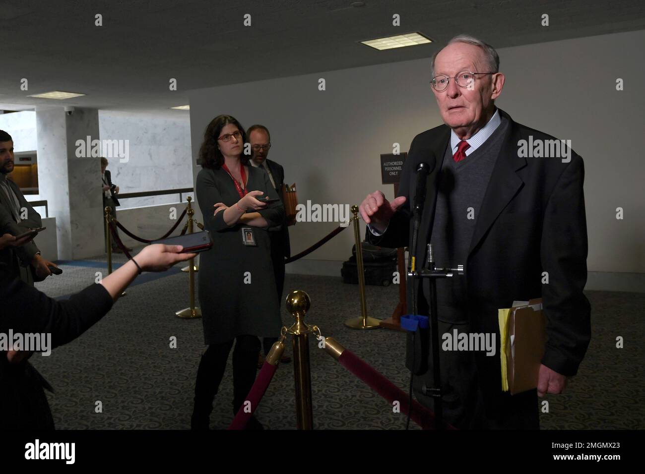Sen. Lamar Alexander, R-Tenn., talks with reporters following a ...