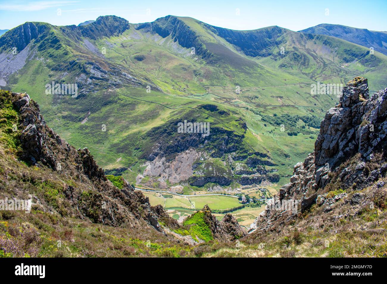 This stunning view of a valley filled with trees and rocky cliffs Stock ...
