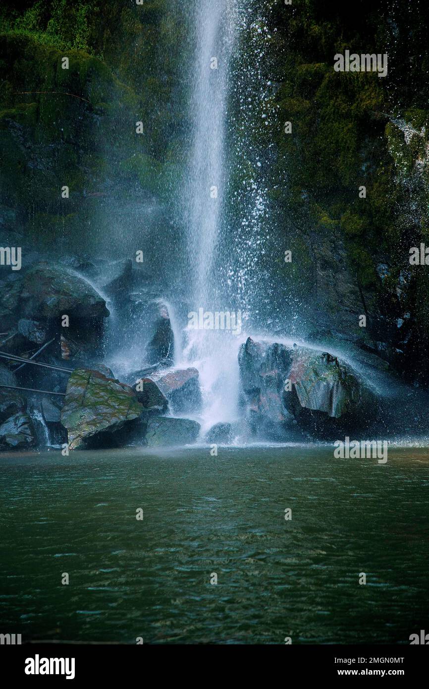 A vertical shot of a waterfall in a nature reserve Stock Photo - Alamy