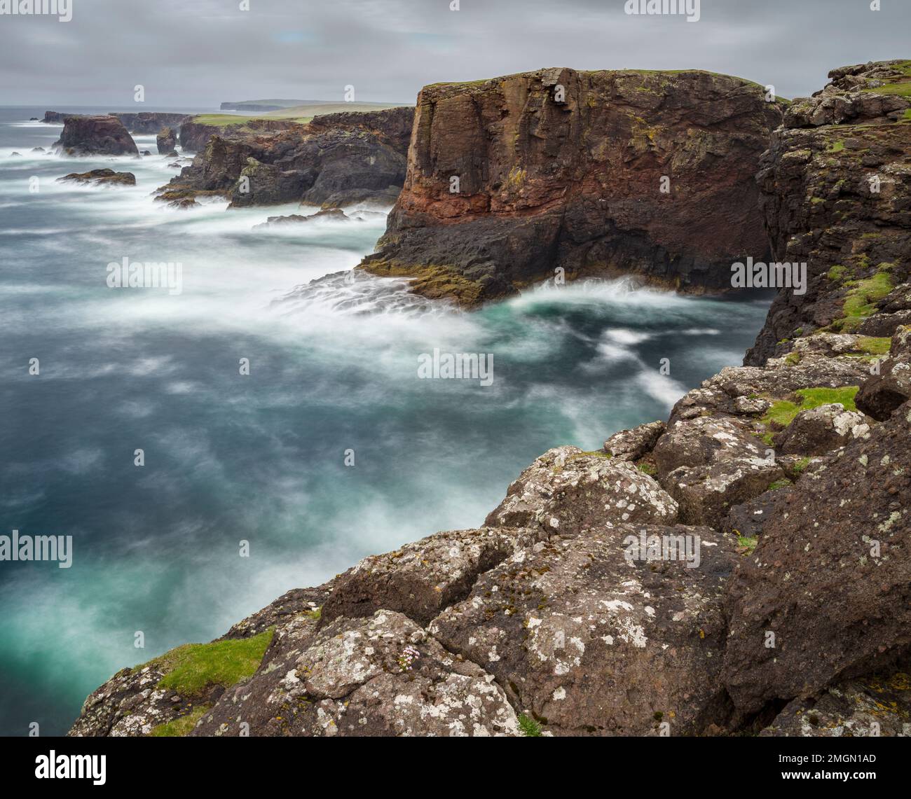Landscape on the Eshaness peninsula. The famous cliffs and sea stacks ...