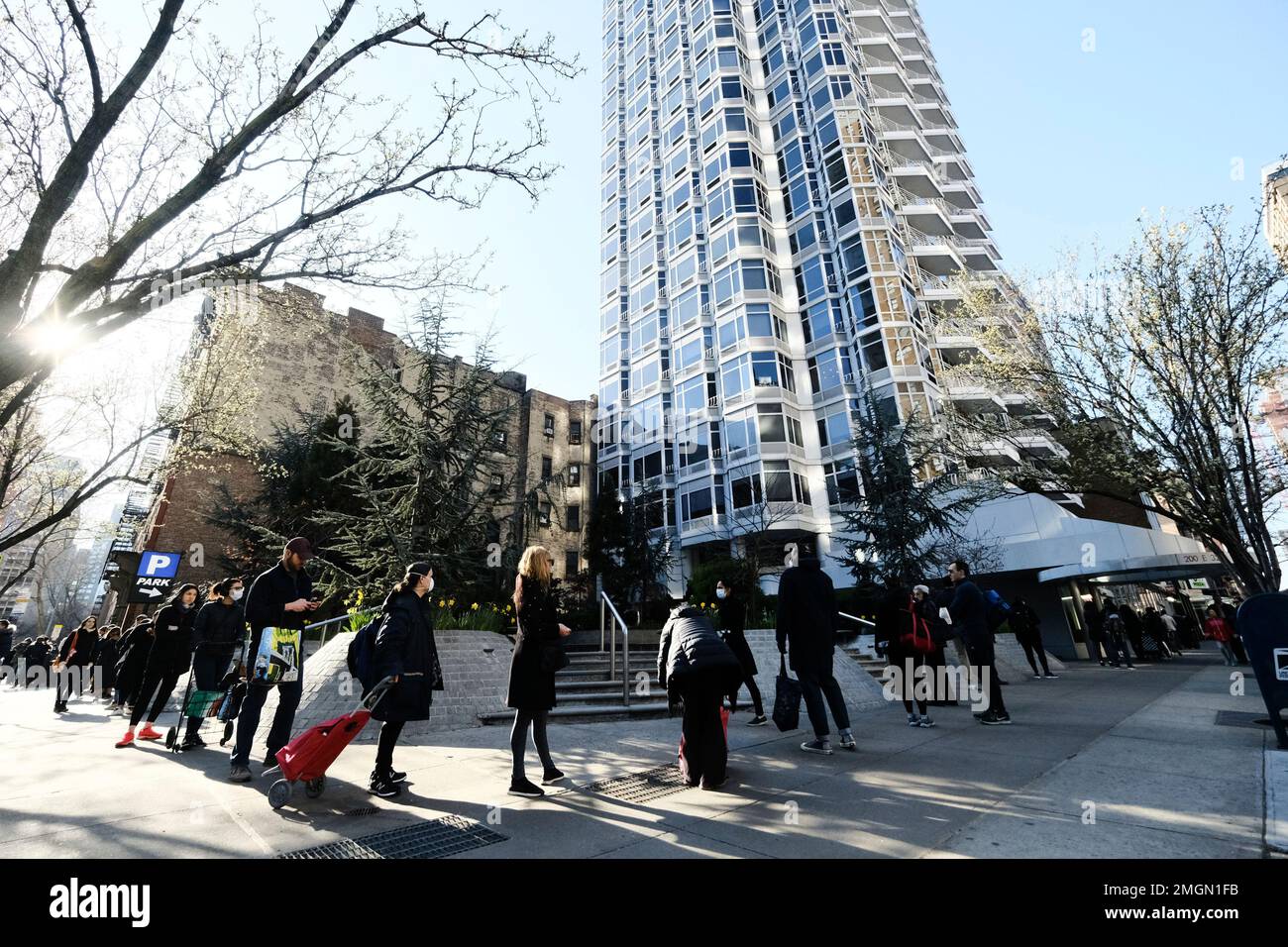 Customers wait on line outside Trader Joe's on Wednesday, March 18 ...