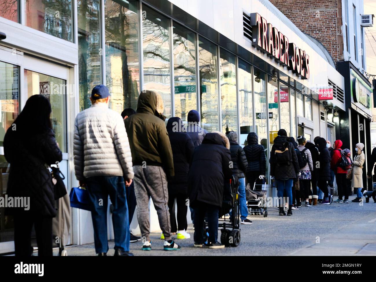 Customers wait on line outside a supermarket on Wednesday, March 18 ...