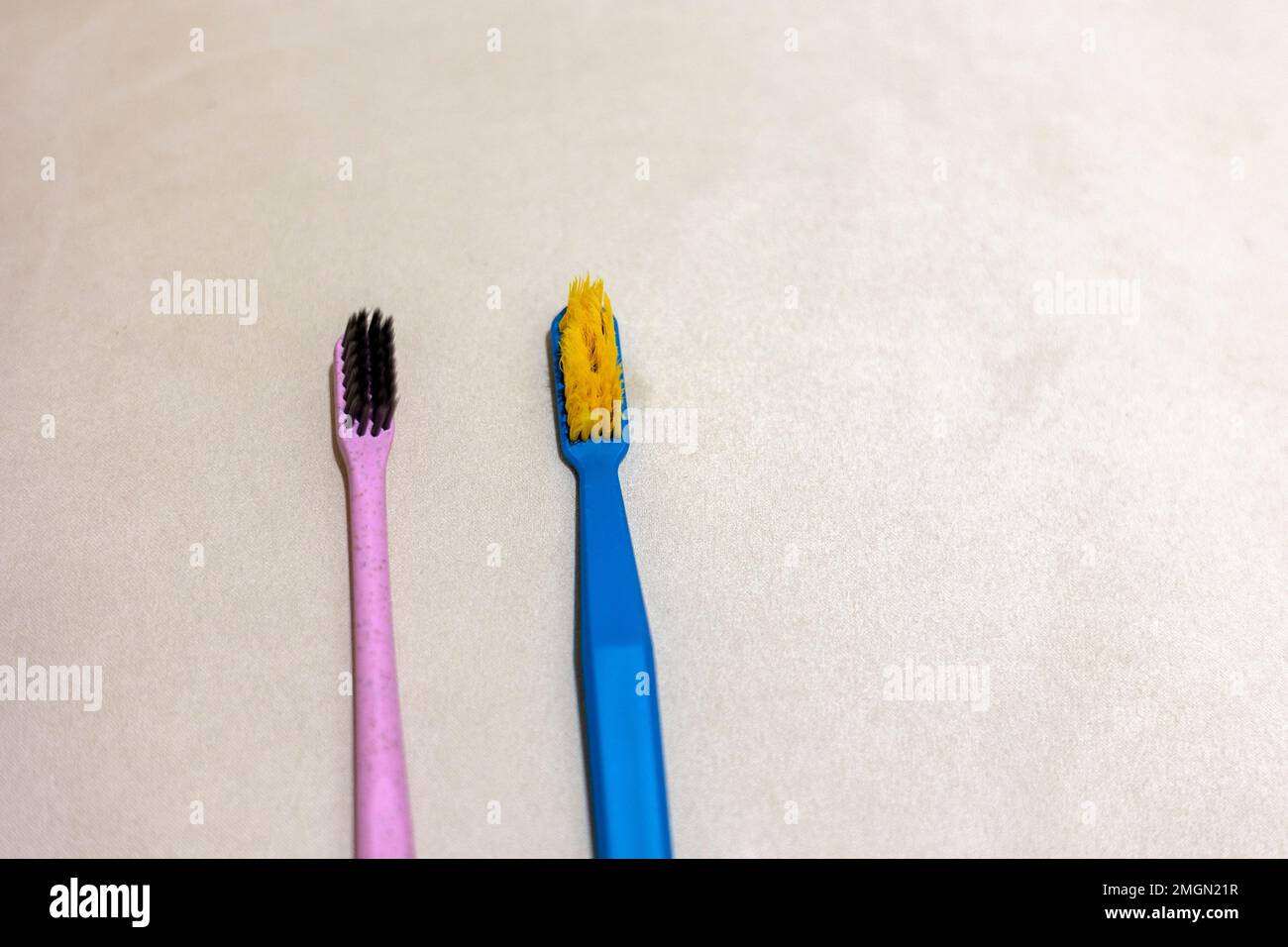 New toothbrush and old toothbrush in bathroom Stock Photo - Alamy