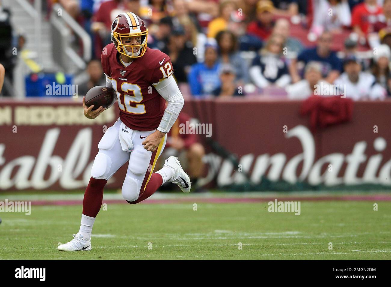Washington Redskins quarterback Colt McCoy (12) scrambles during the ...