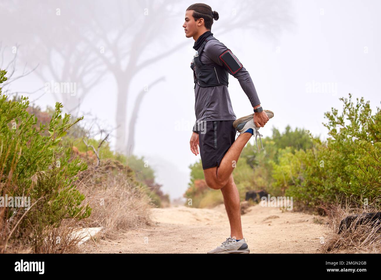 Fitness, stretching legs and man on nature trail for running, marathon ...