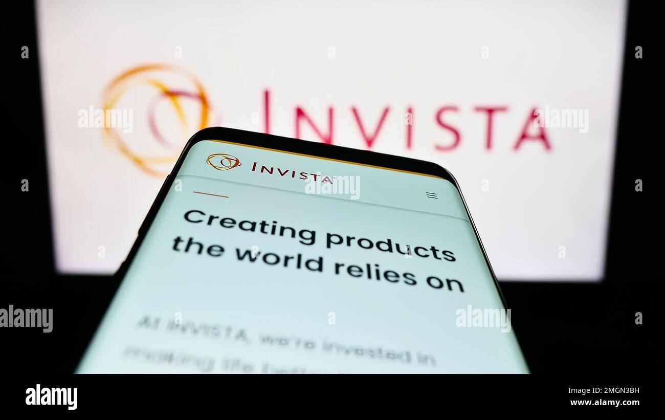 Mobile phone with website of US chemical company Invista on screen in ...
