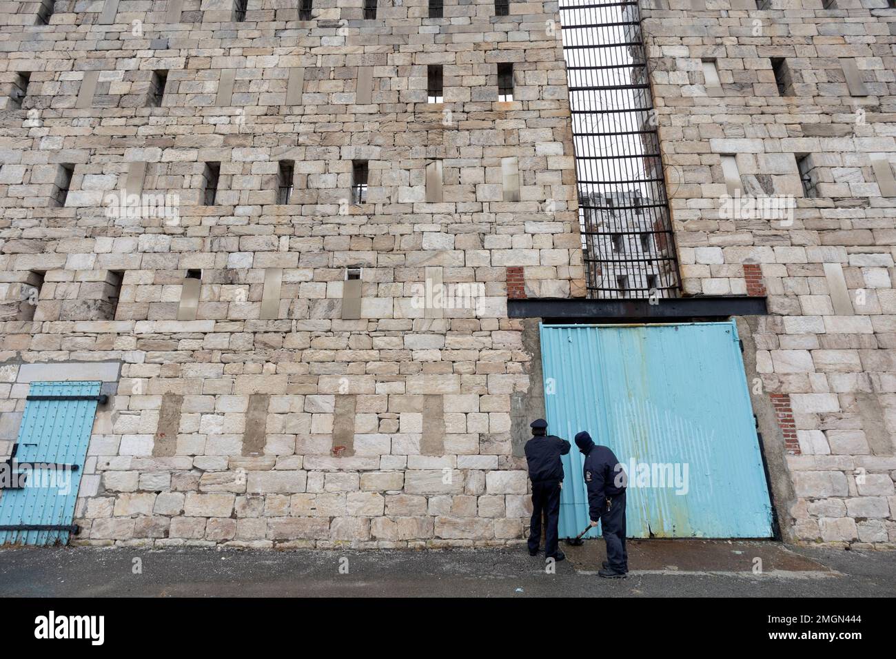 In this Feb. 13, 2020 photo, prison employees open a door to a former ...