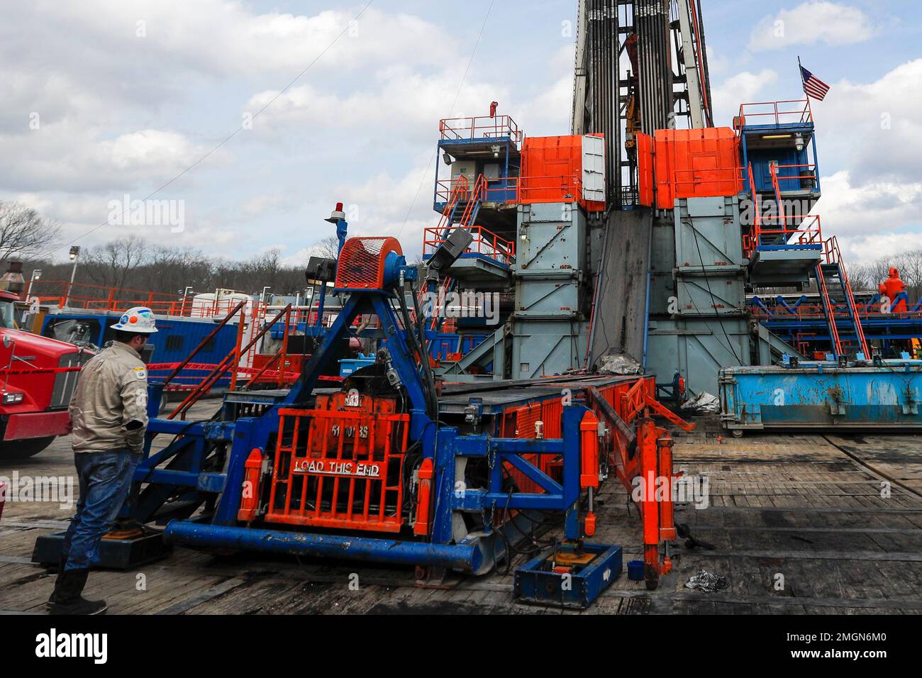 In this photo made on Thursday, March 12, 2020, a worker walks past the ...