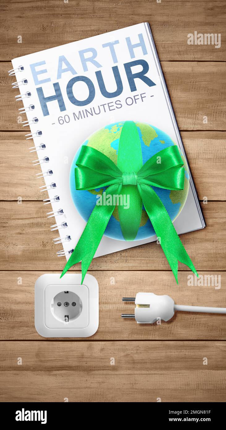 Electricity cable and plug connect. Earth Hour Concept Stock Photo - Alamy