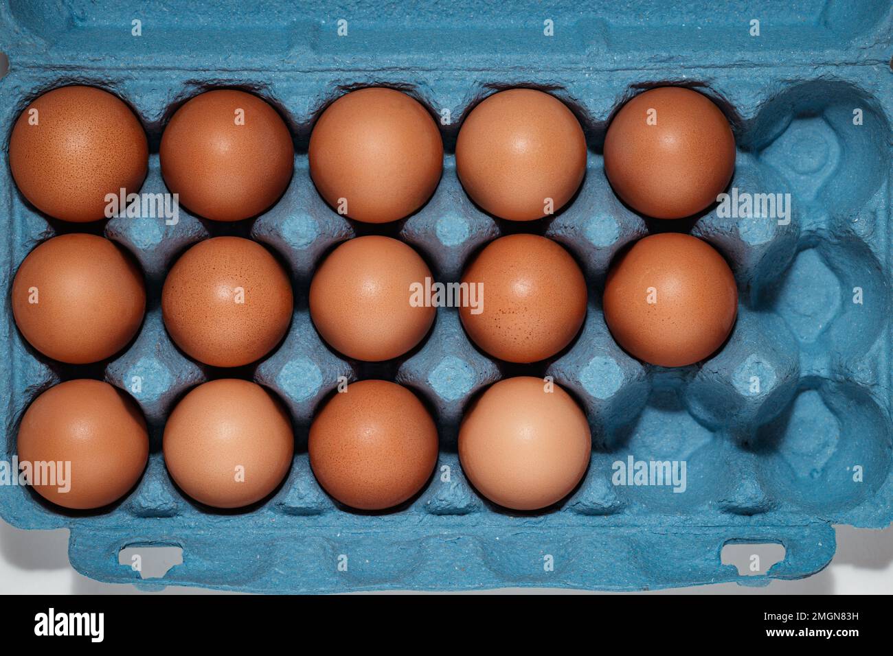 top view freerange fresh eggs in blue recycled carton crate. Farm ...