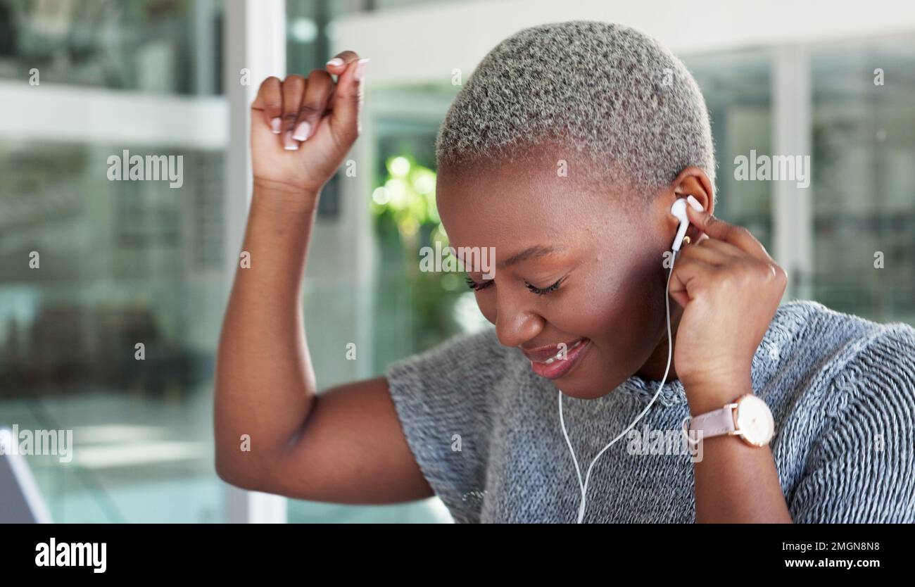 Employee, earphones and listening to music while dancing in an office ...