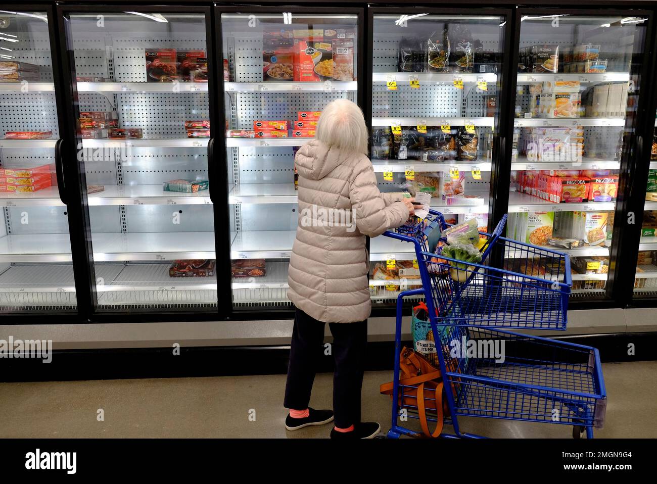 A customer looks for frozen items at the Meijer store, Monday, March 16 ...