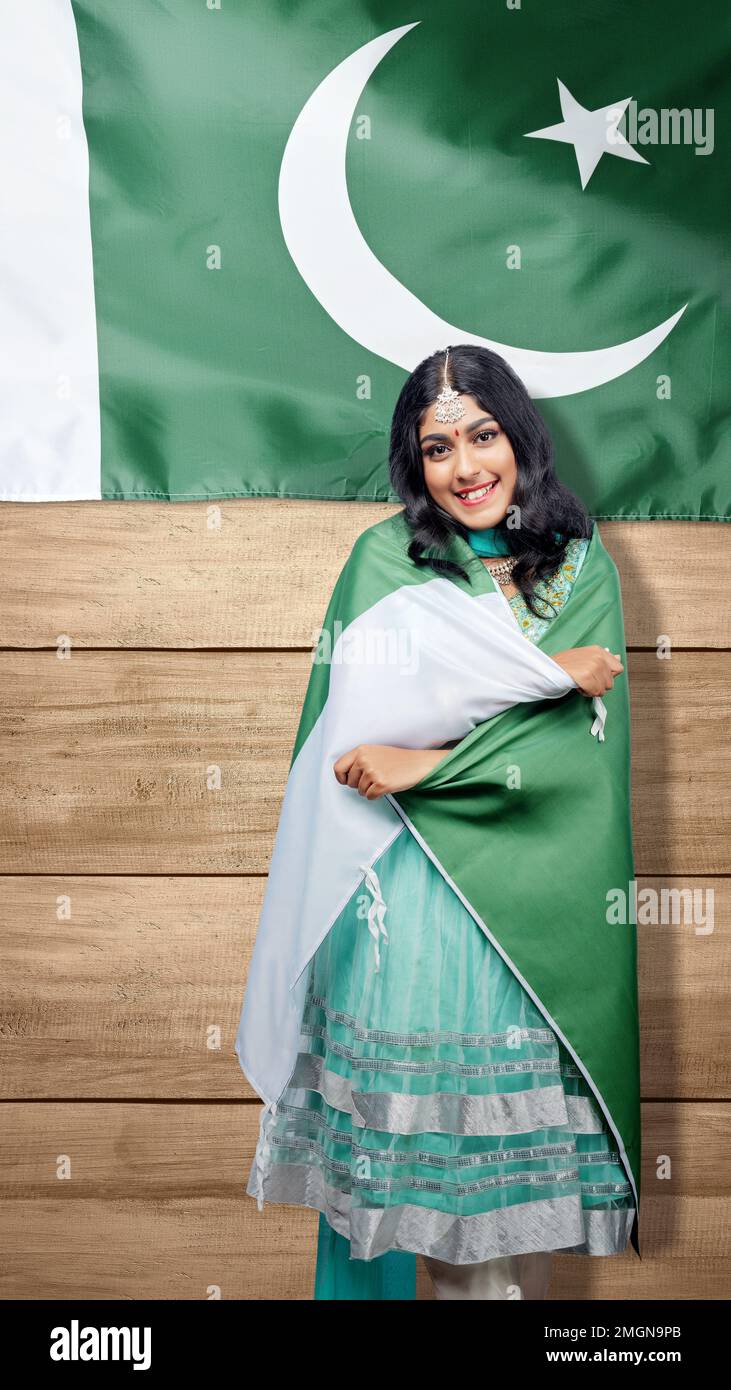 Asian woman holding Pakistan flag. Pakistan Resolution Day Stock Photo ...