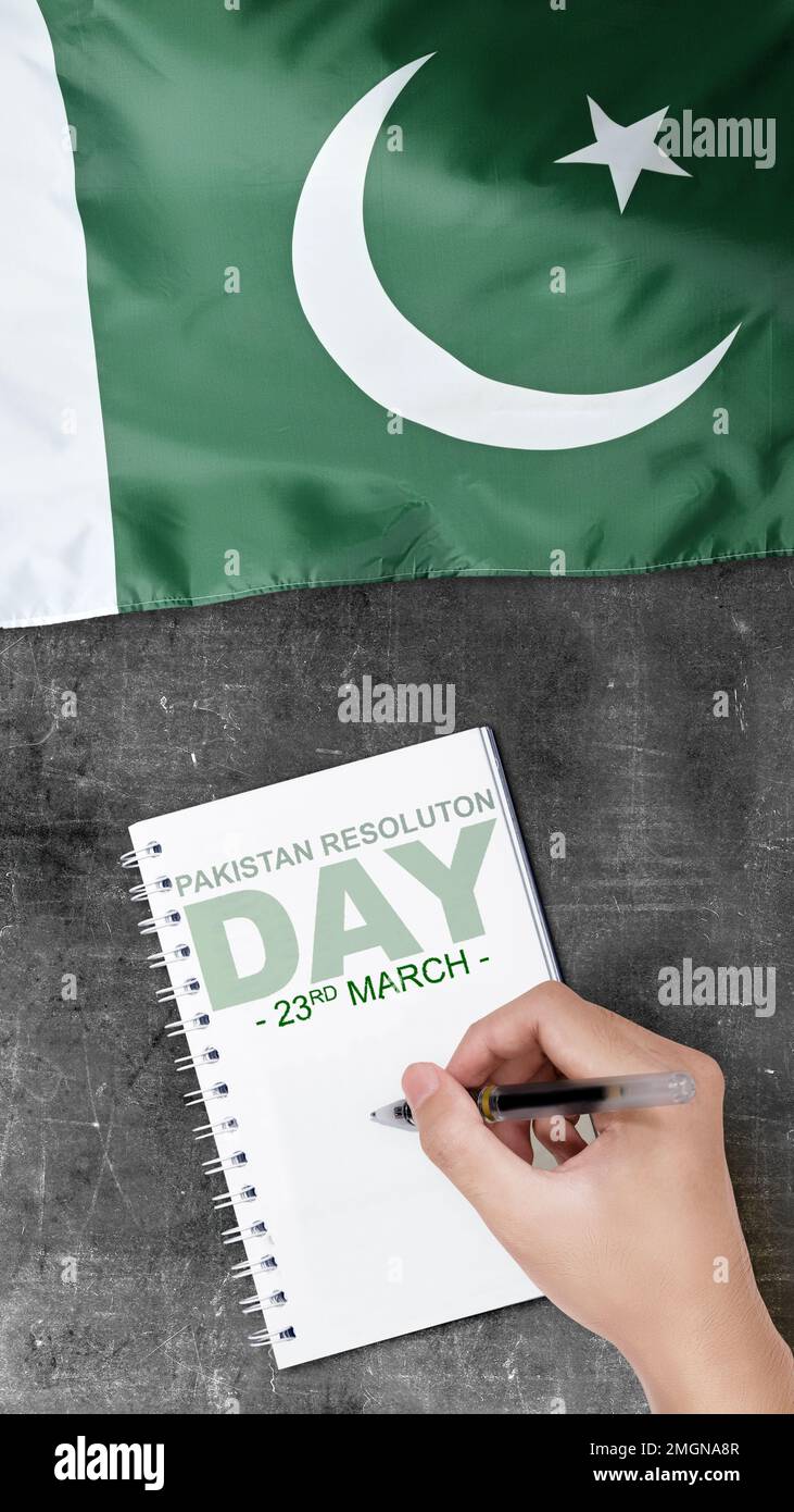 Human hand write something in a notebook. Pakistan Resolution Day Stock ...