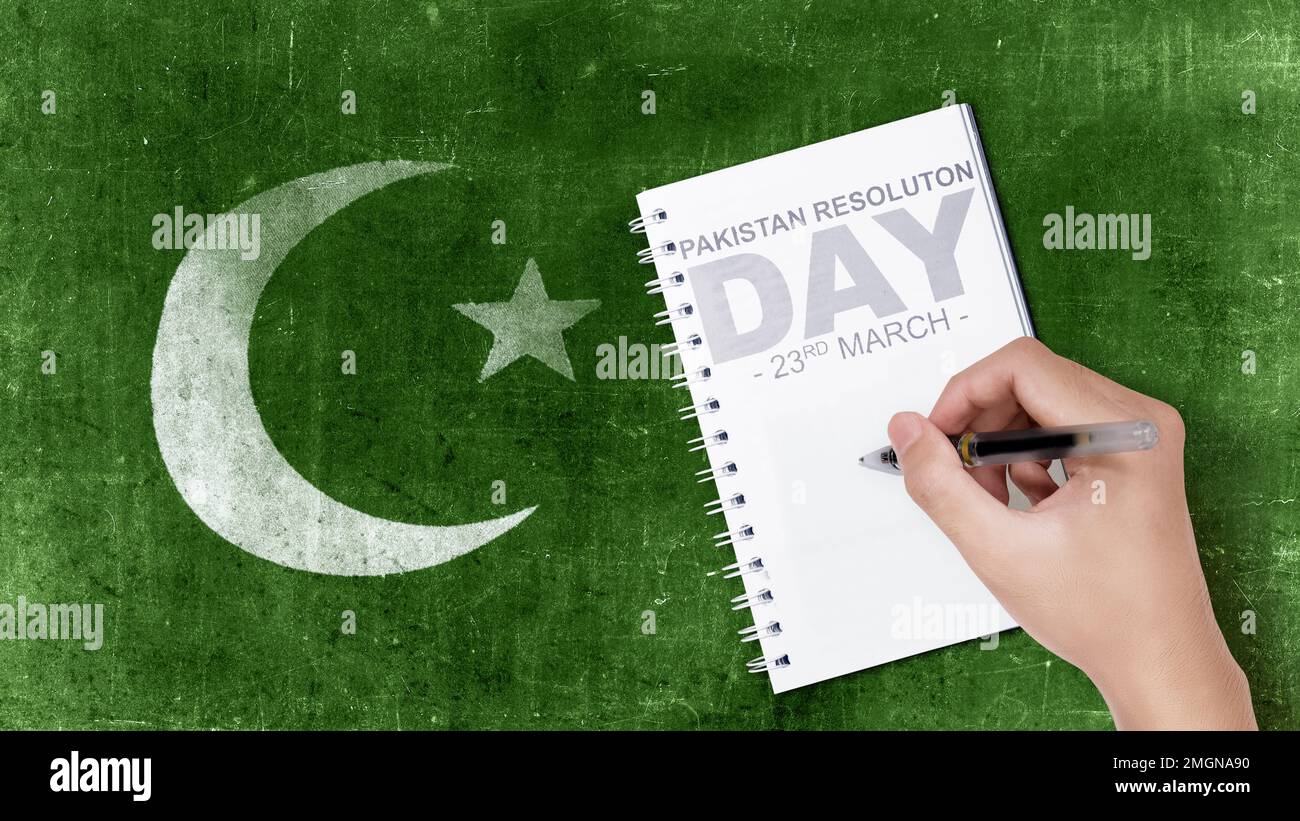Human hand write something in a notebook. Pakistan Resolution Day Stock ...
