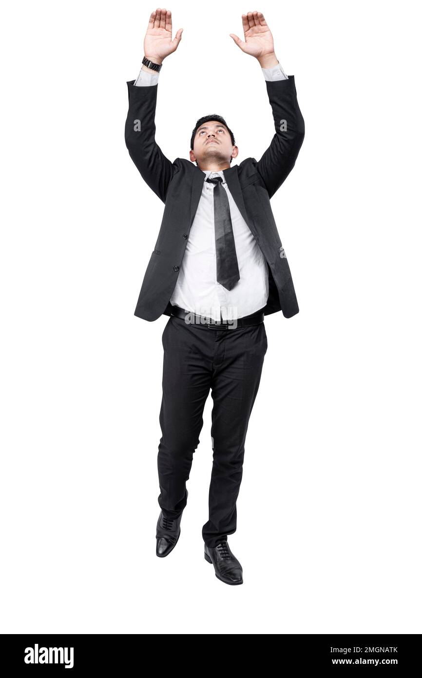 Asian businessman standing and climbing something isolated over white ...