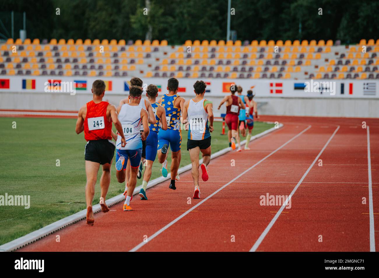 Energetic image of male athletes pushing their limits in middle ...