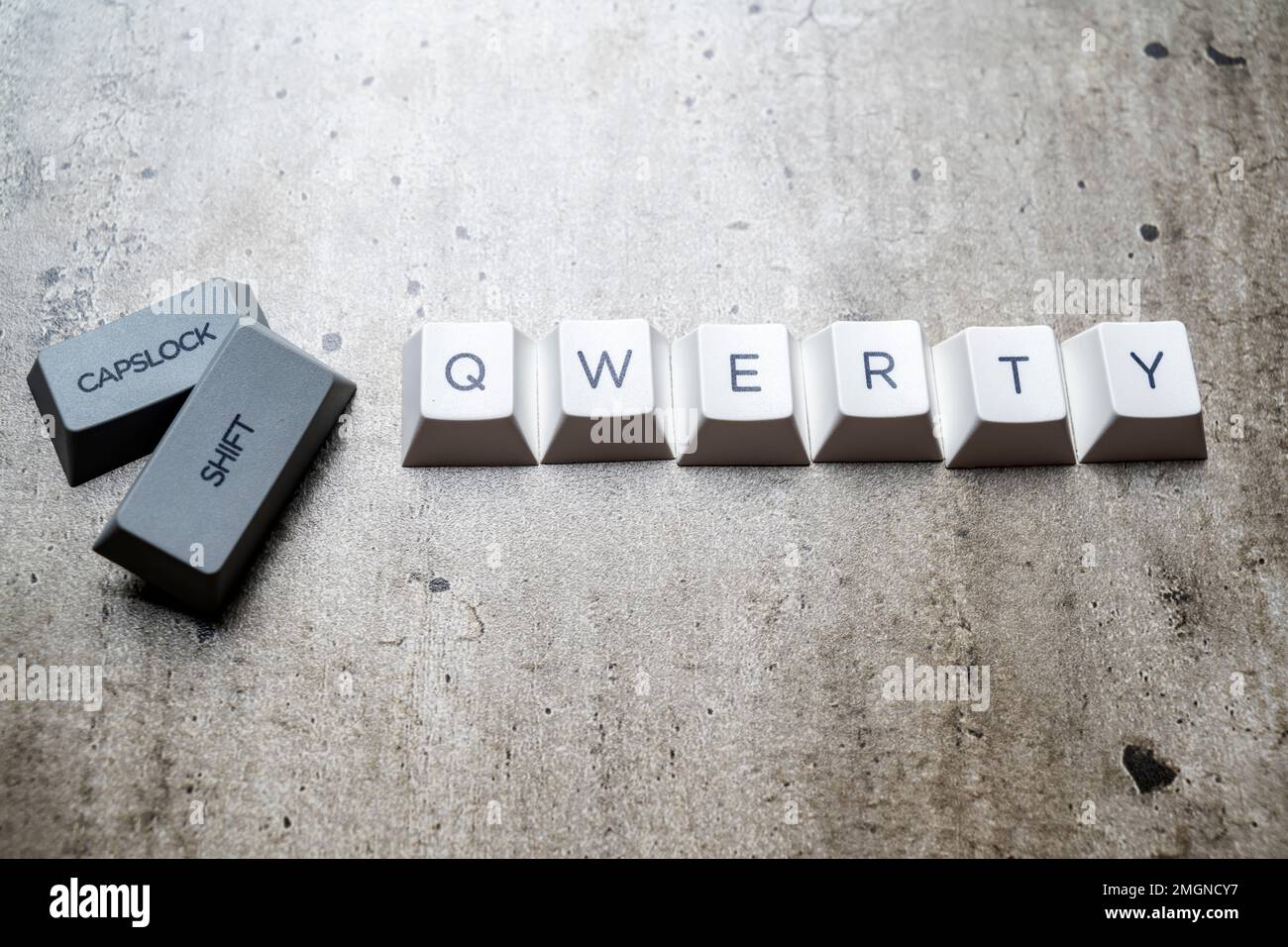 Mechanical keyboard button with "qwerty" text on textured background ...