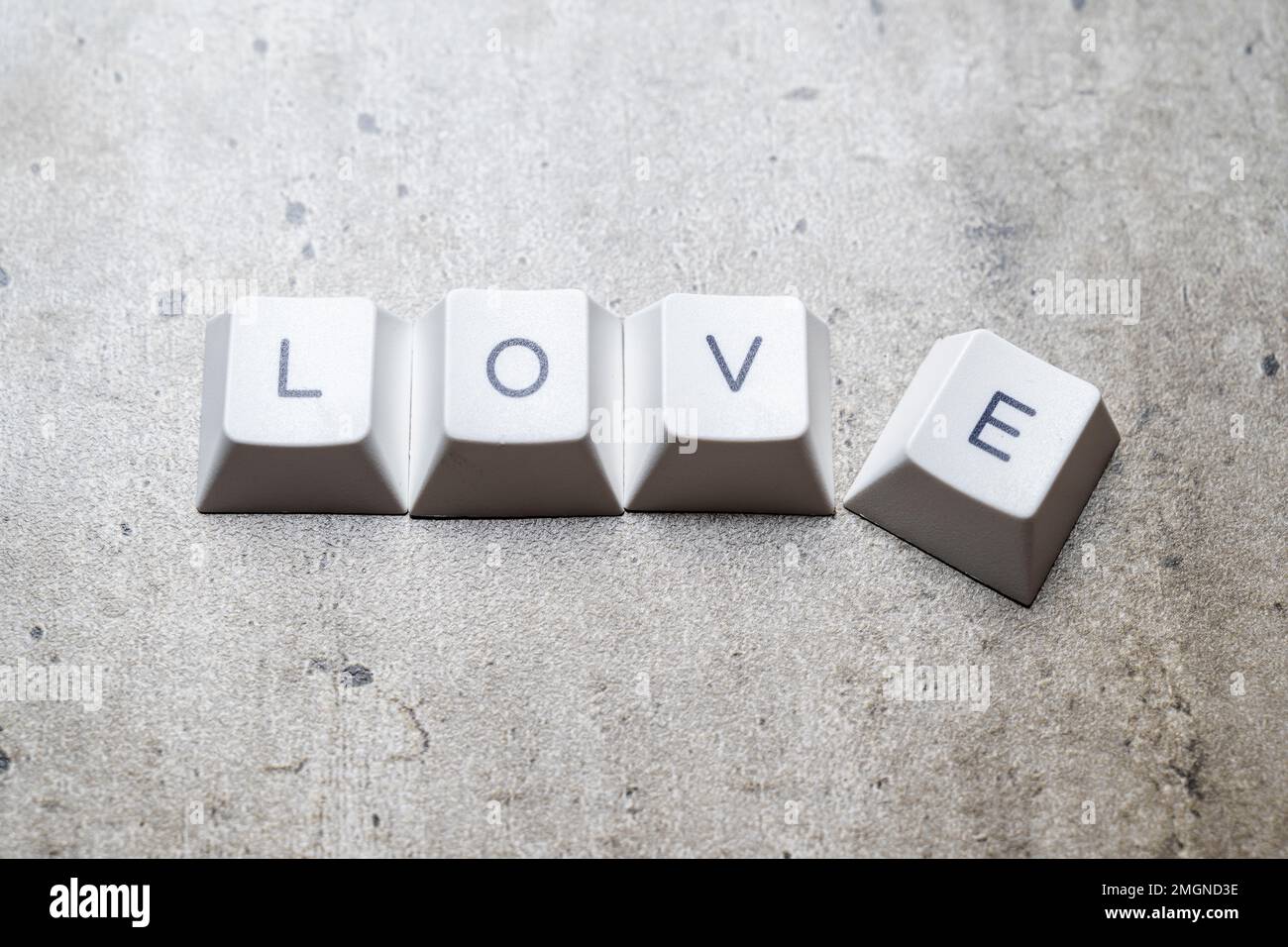 Mechanical keyboard button with "love" text on textured background ...