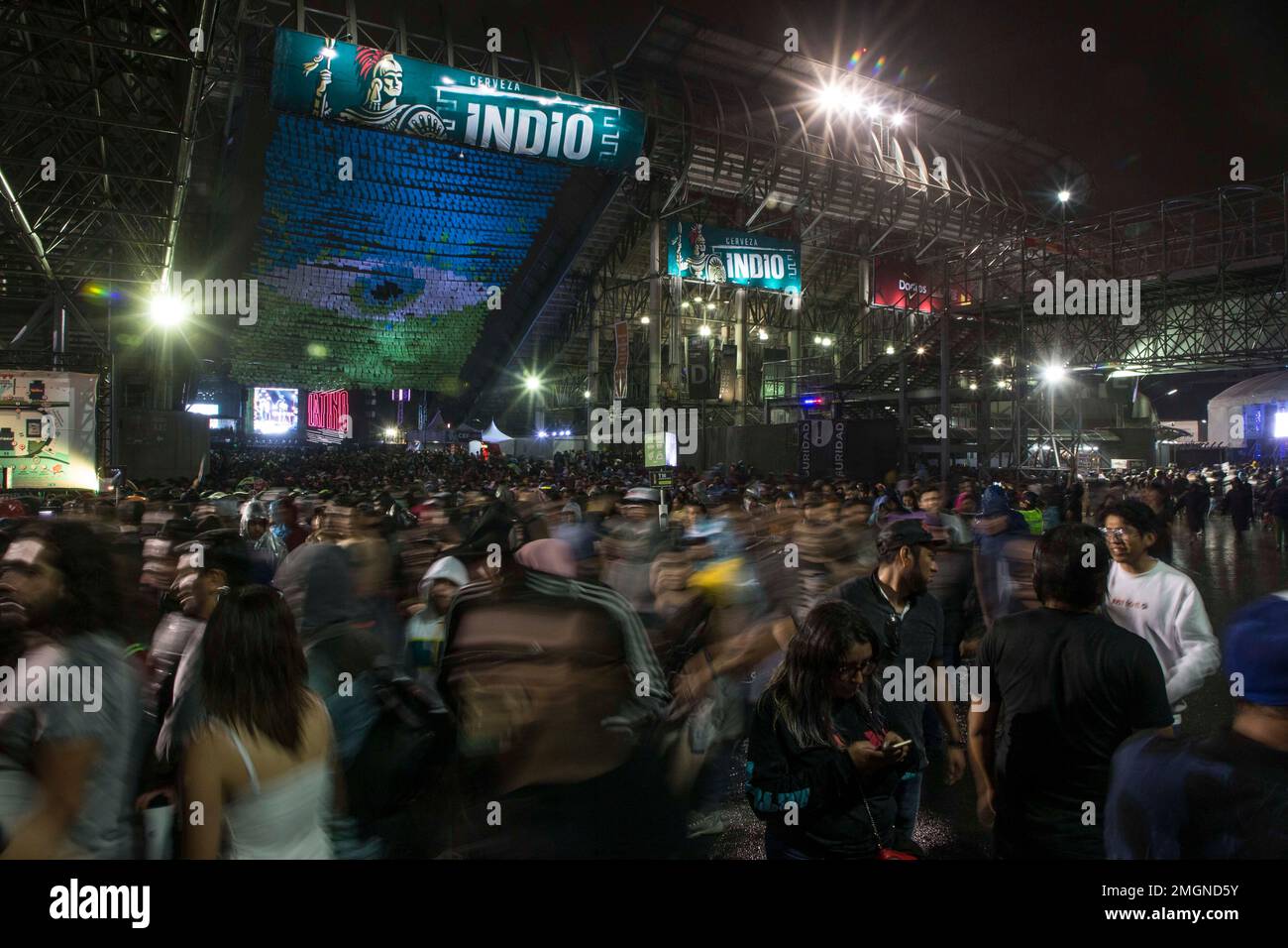 Spectators walk in the Foro Sol during the Vive Latino music festival ...