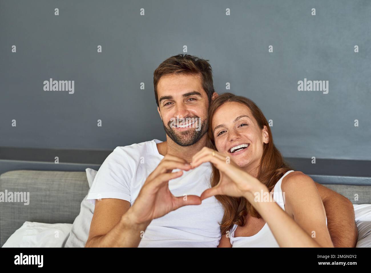Young couple making love bed hi-res stock photography and images - Alamy
