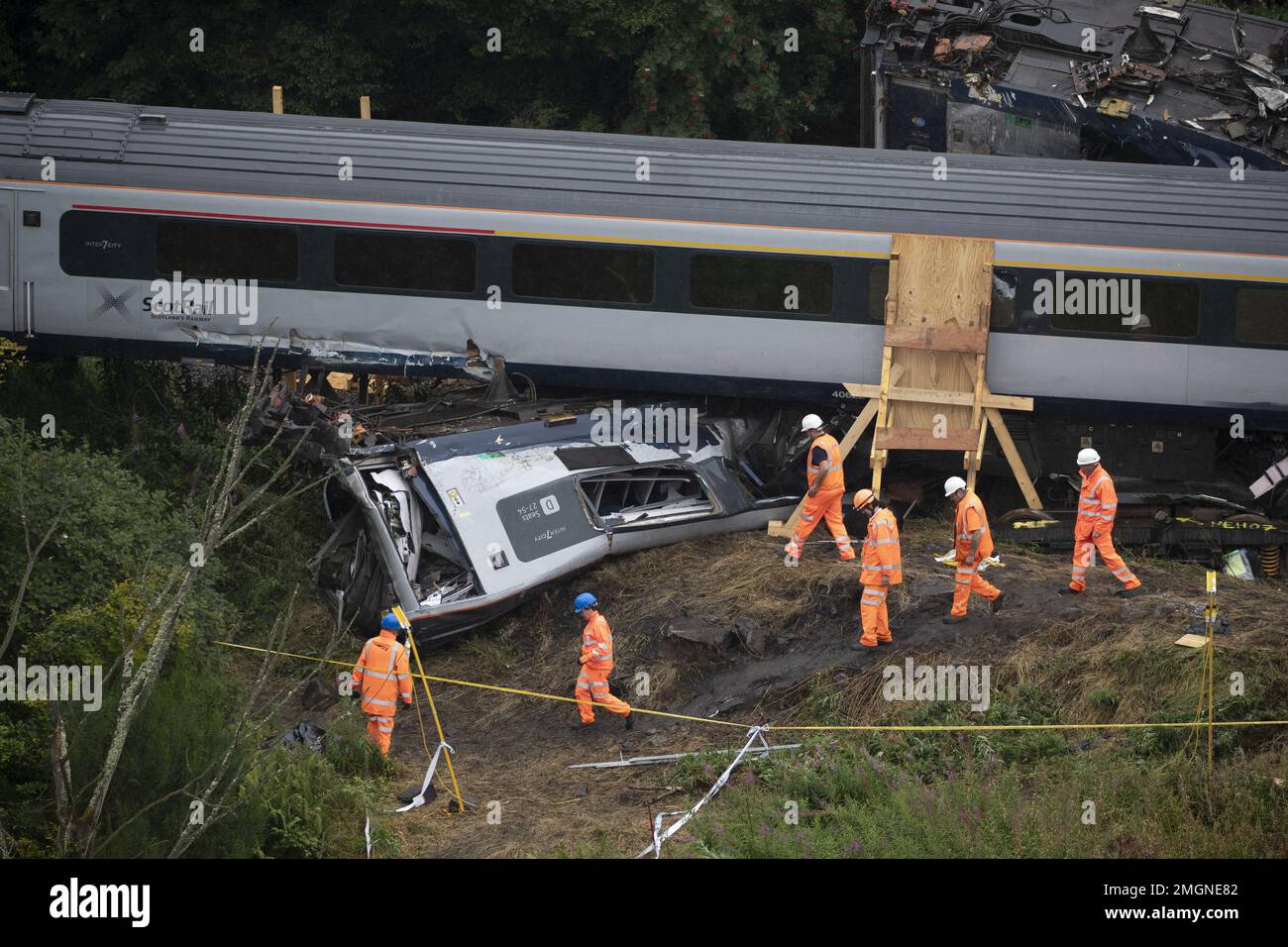 File photo dated 21/08/20 of investigators working at the scene near ...