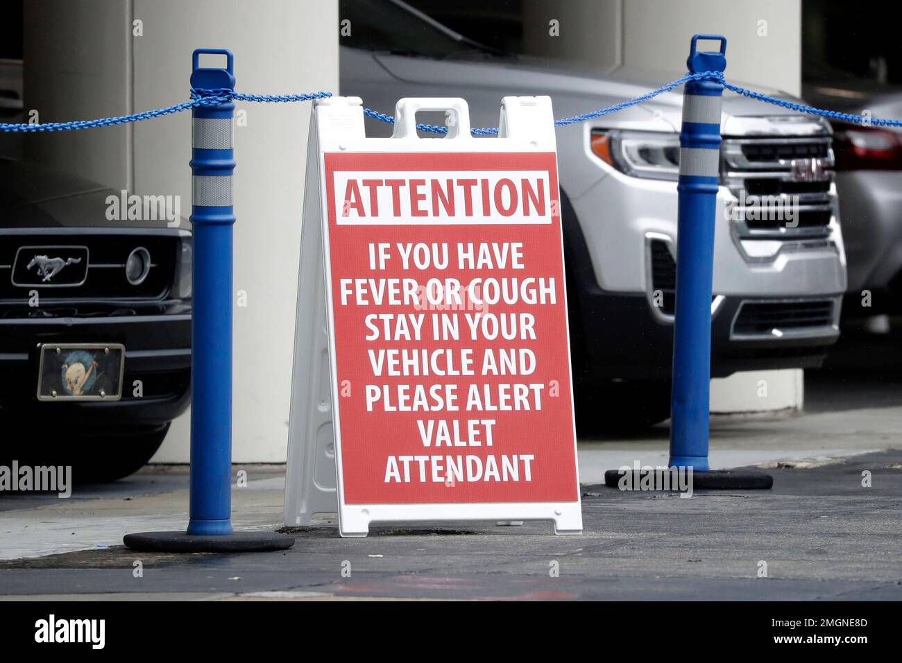 A sign outside the emergency entrance to Emory Hospital advises people ...