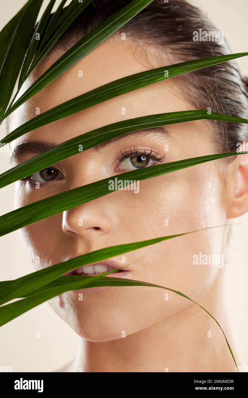 Woman, face and beauty with leaf in skincare for cosmetics or healthy ...
