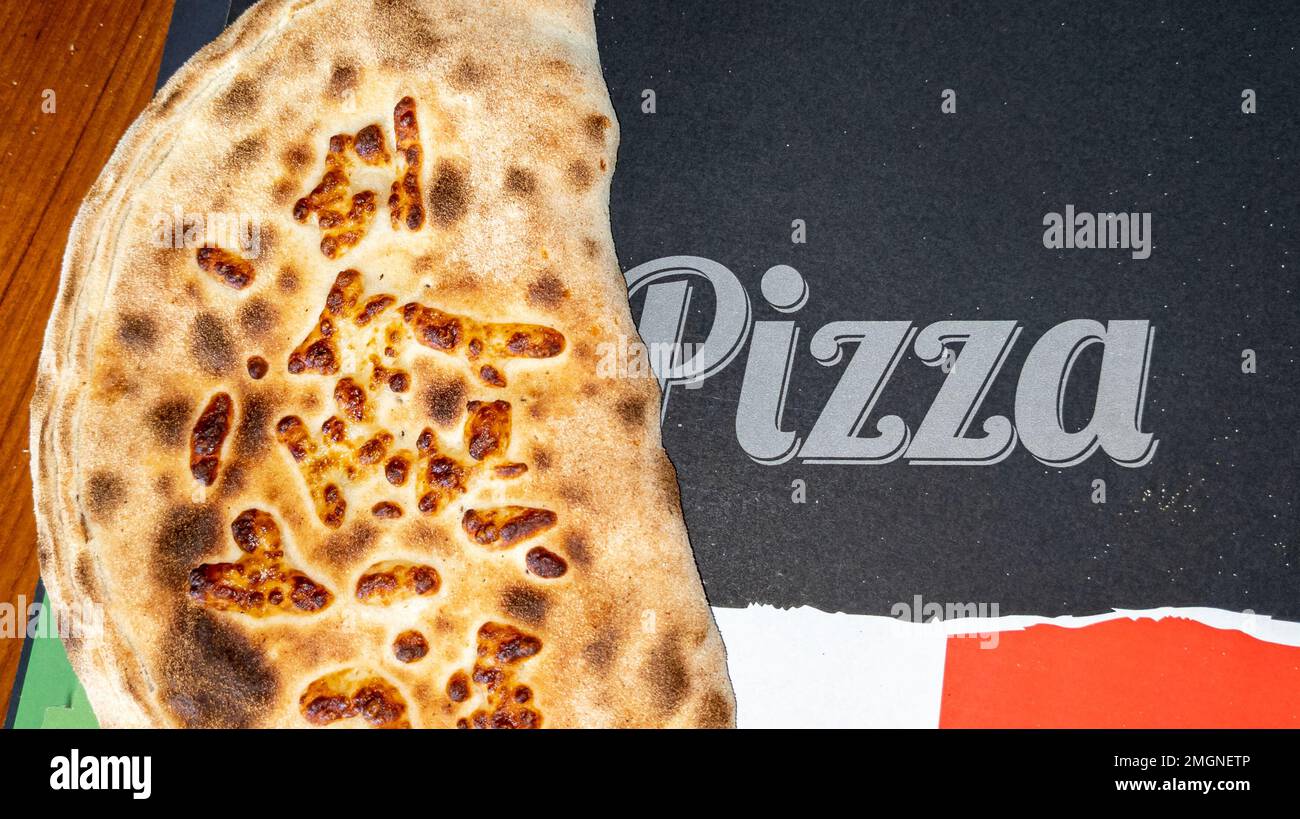 Tasty Cooked calzone pizza over Fast Food Pizzeria Pie Box italian flag ...