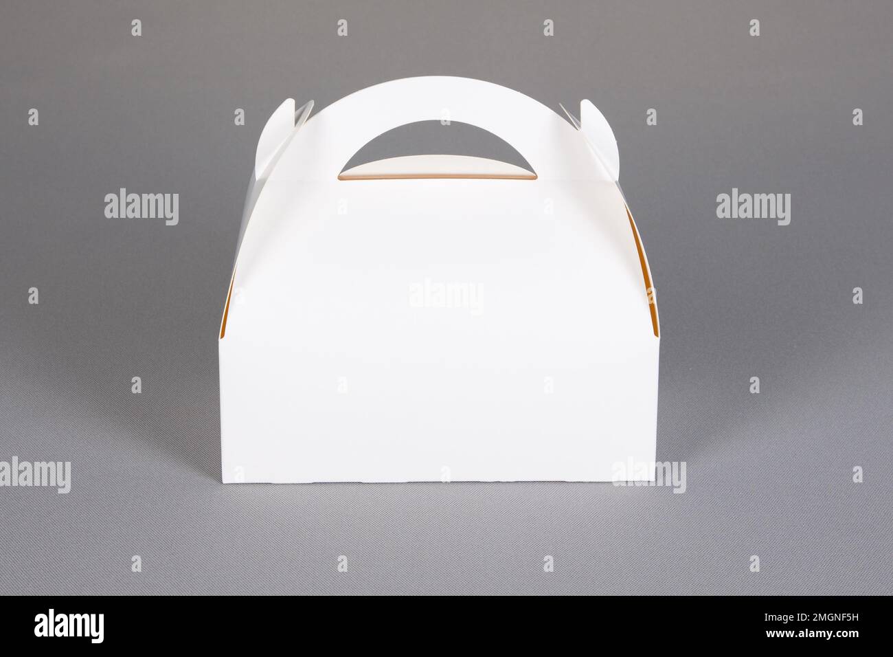 White blank paper pastry candy box with handle in grey background for ...