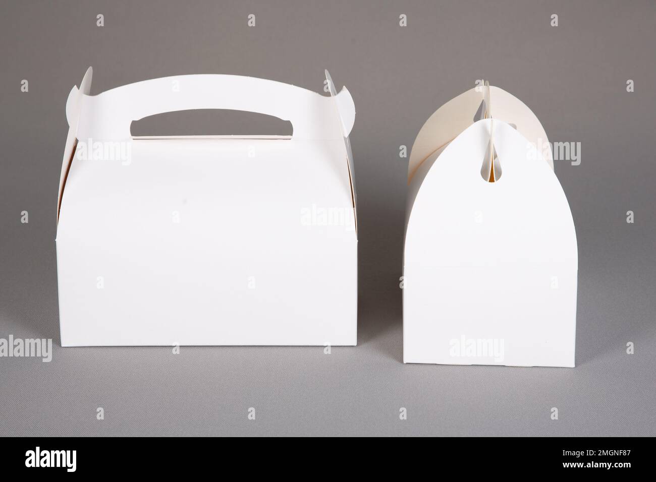 two white blank paper packaging for bakery large and profil box with ...