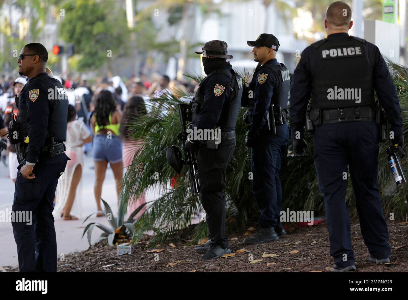 Miami Beach police officers patrol along Ocean Drive during spring ...