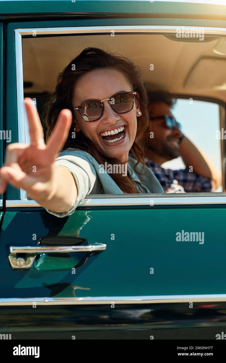 Peace out. Cropped portrait of an attractive woman giving you a peace ...