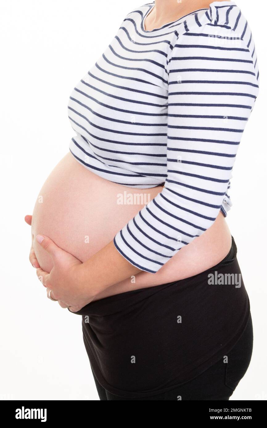 Portrait of beautiful belly tummy pregnant woman on white light ...