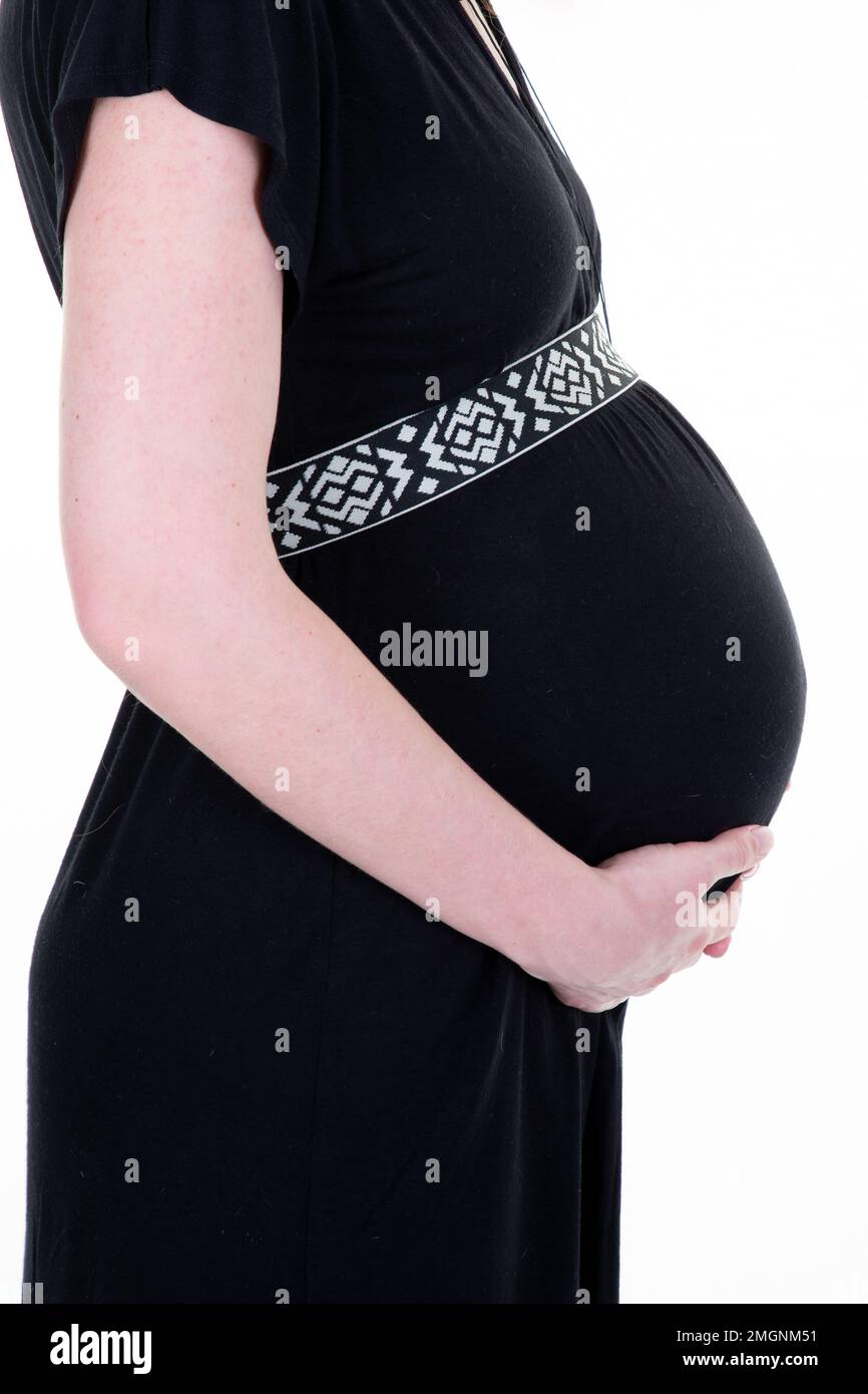 Pregnant woman side profile belly in dress black view in white ...